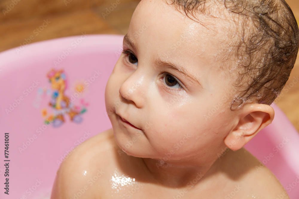 Cute little girl bathes in a shower Stock Photo | Adobe Stock