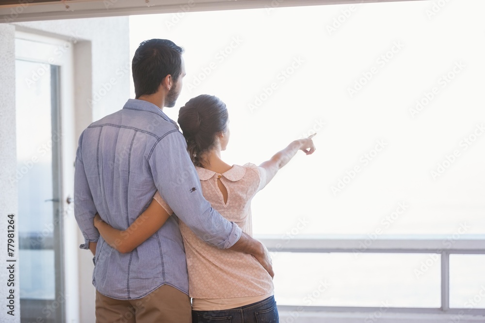 Cute couple looking out the window Stock Photo | Adobe Stock