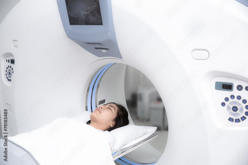 Asian lady sleep on a CT Scan bed Stock Photo | Adobe Stock