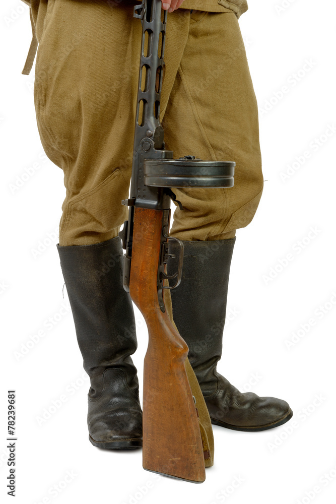 Soviet submachine gun at the foot of a soldier Stock Photo | Adobe Stock