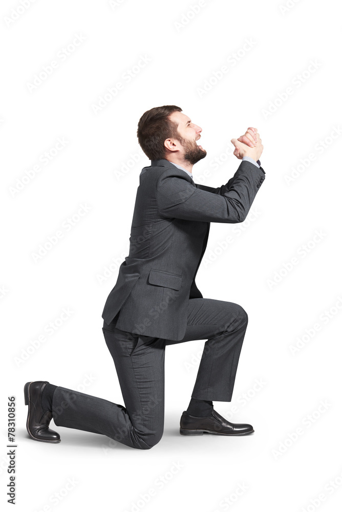 crying man standing on one knee Stock Photo | Adobe Stock