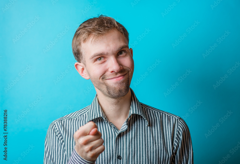 Closeup portrait of young man giving thumb, finger fig gesture that you ...