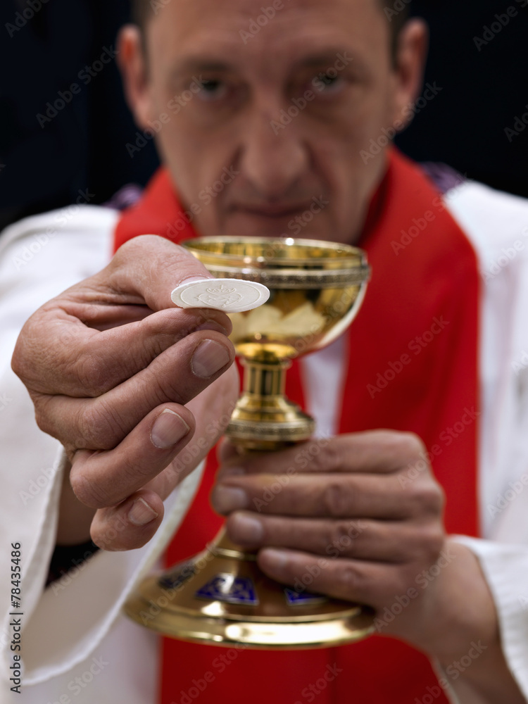 Communion. Jesus Christ body and Clergy Stock Photo | Adobe Stock