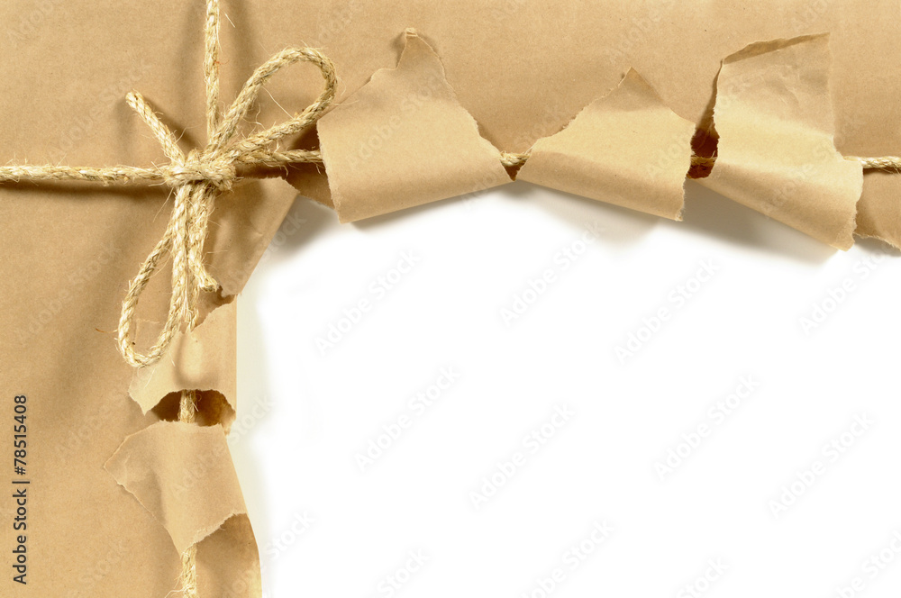 Torn brown parcel or package wrapping paper border frame opening to see ...