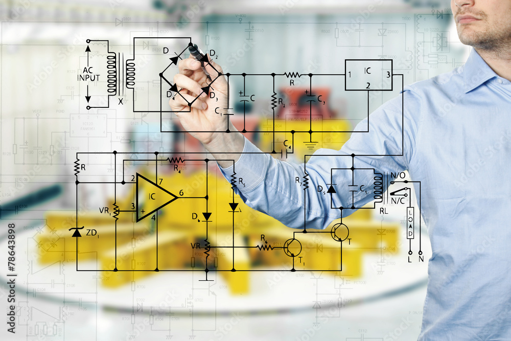 Foto de electrical engineer draws a diagram of a circuit. power plant ...