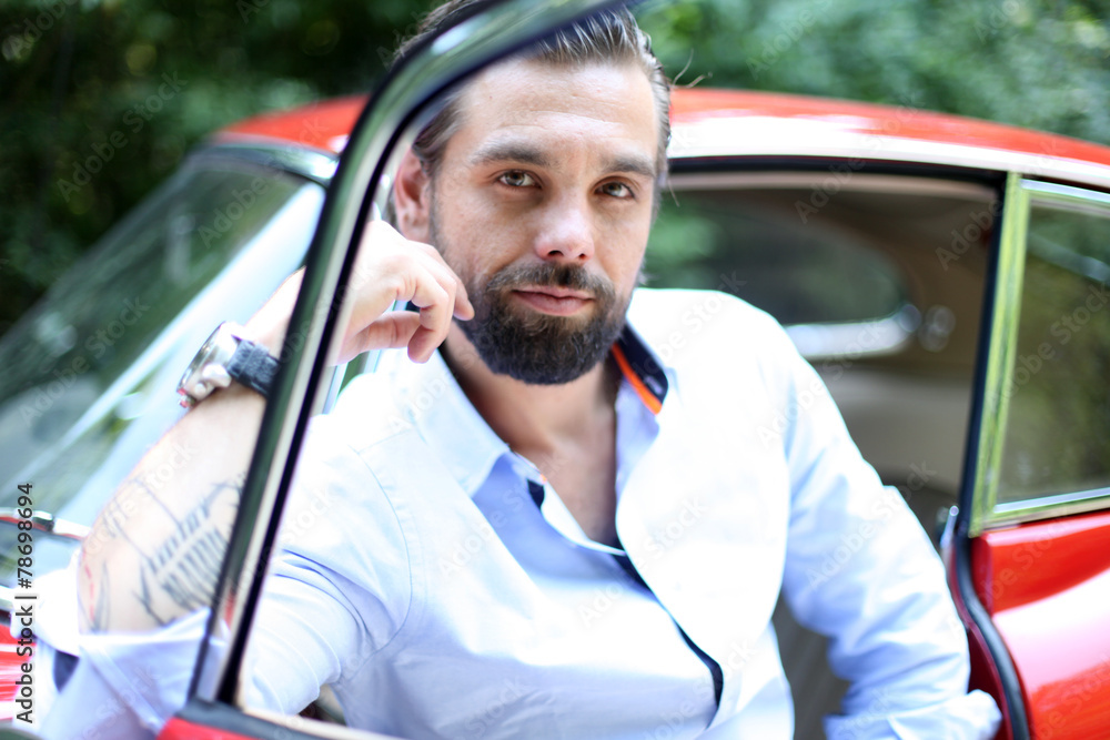 Mann mit Bart im Oldtimer Stock Photo | Adobe Stock