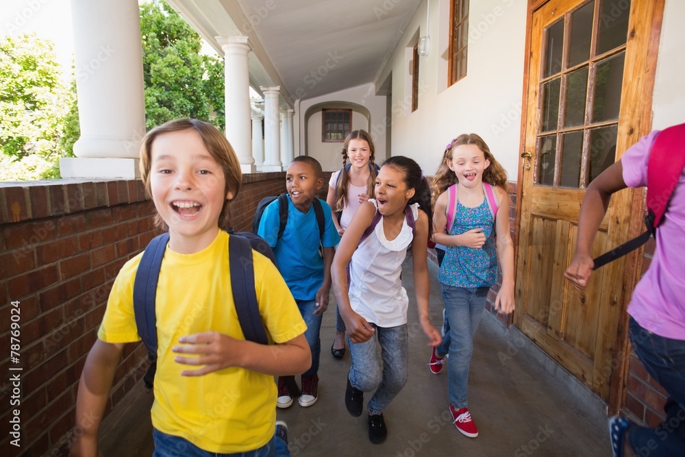 Cute pupils running down the hall Stock Photo | Adobe Stock