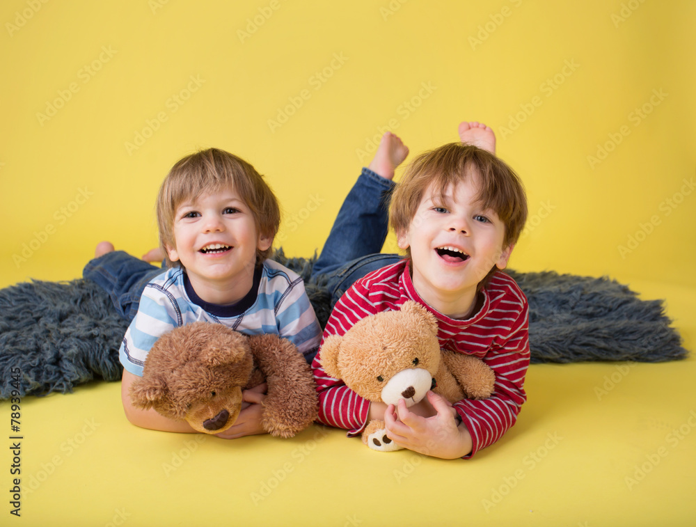 Happy Kids, Siblings, Hugging stuffed toys Stock Photo | Adobe Stock