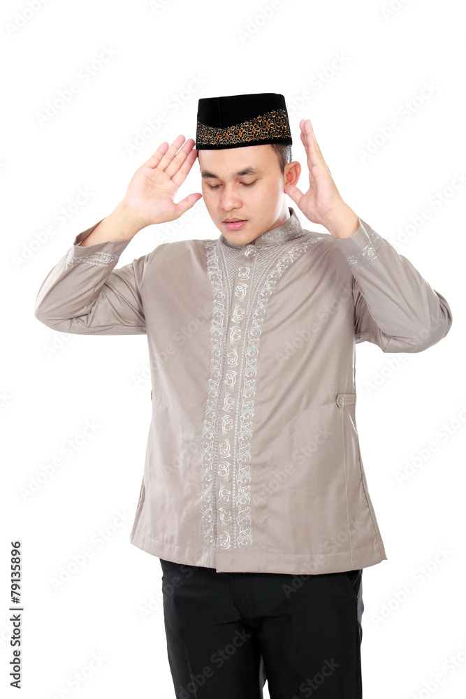 young muslim man focus praying Stock Photo | Adobe Stock
