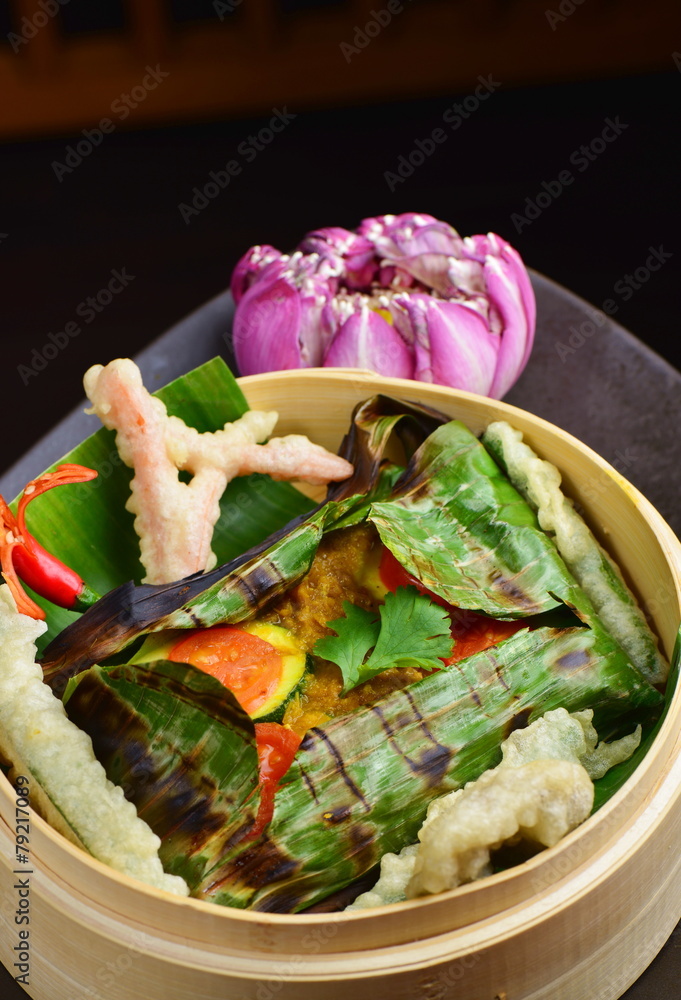 Red snapper fish fillet wraped in banana leaf with tempura Stock Photo ...