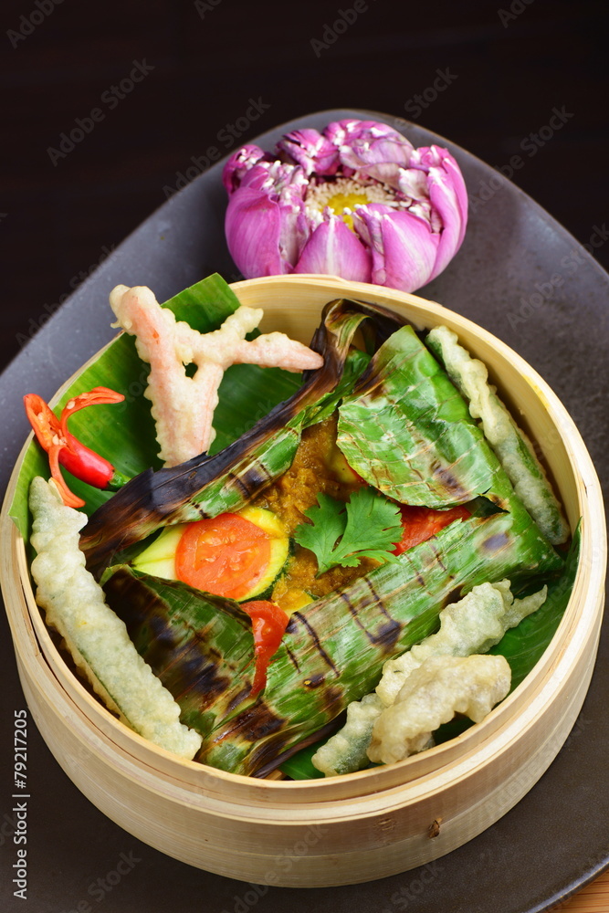 Red snapper fish fillet wraped in banana leaf with tempura Stock Photo ...