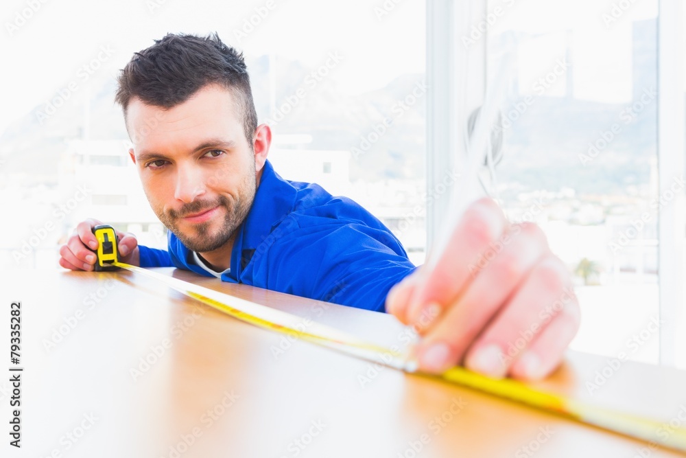 Handyman Measuring Wood Board Stock Photo Adobe Stock handyman-measuring-wood-board-stock-photo-adobe-stock