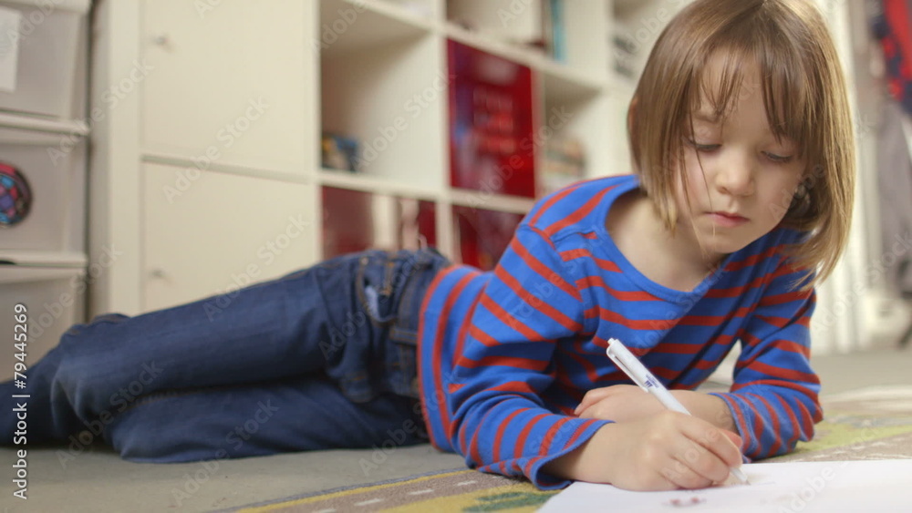 Happy little girl busy drawing with coloured pencil Stock Video | Adobe ...