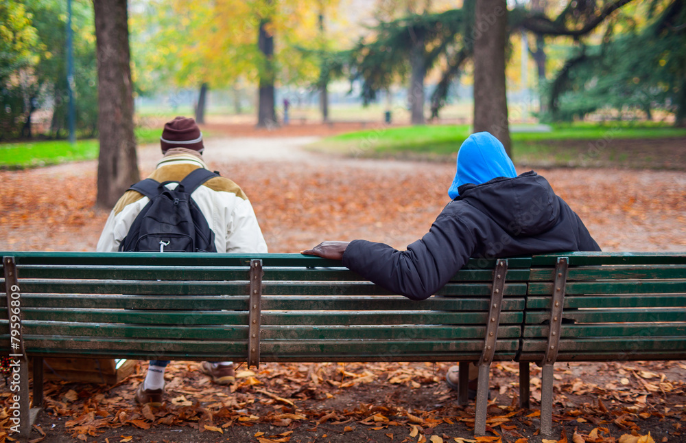 Two people sitting on the bench Stock Photo | Adobe Stock