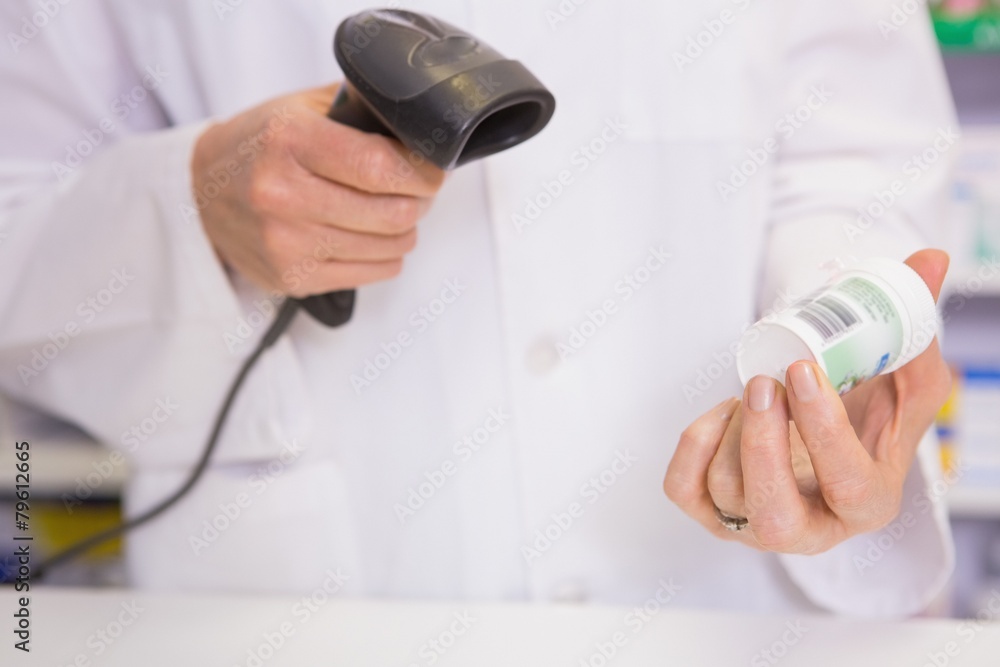 Pharmacist scanning medication with a scanner Stock Photo | Adobe Stock