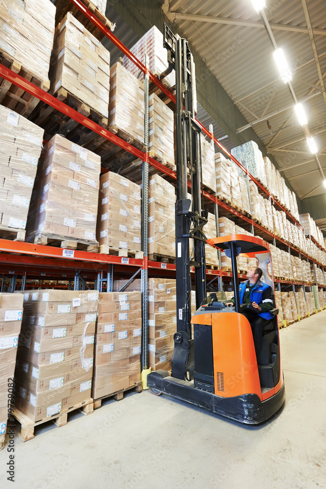 stacker in modern big warehouse Stock Photo | Adobe Stock