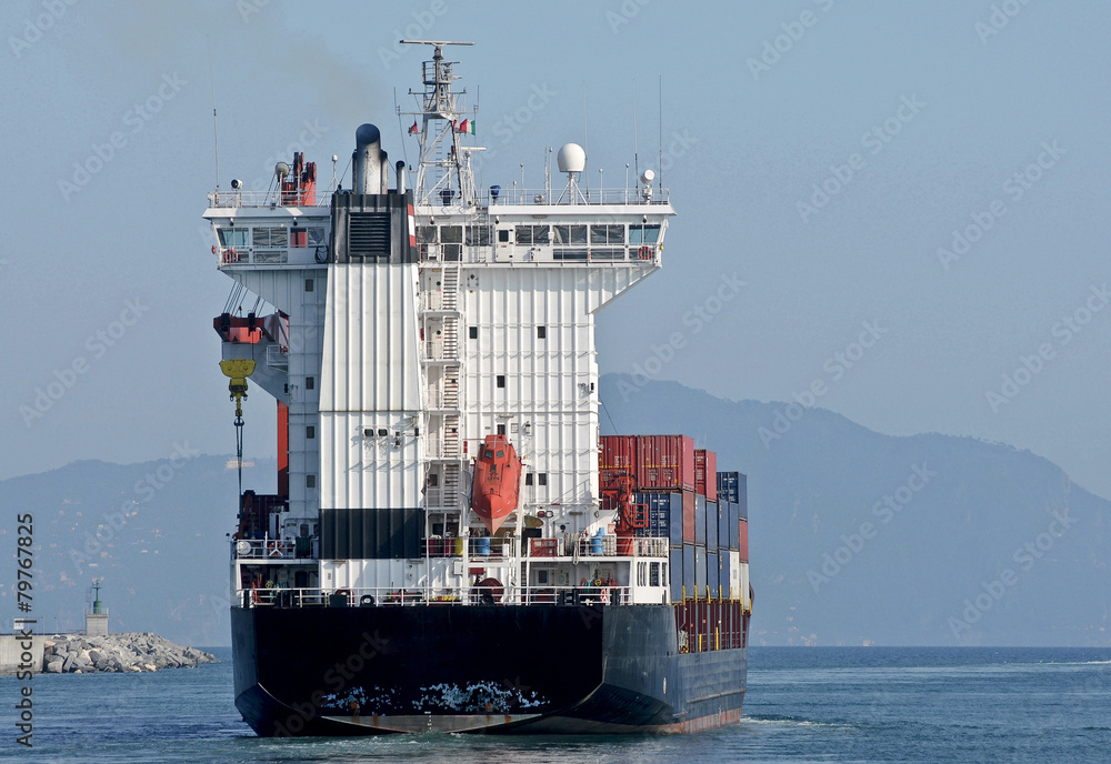 Cargo ship at sea Stock Photo | Adobe Stock
