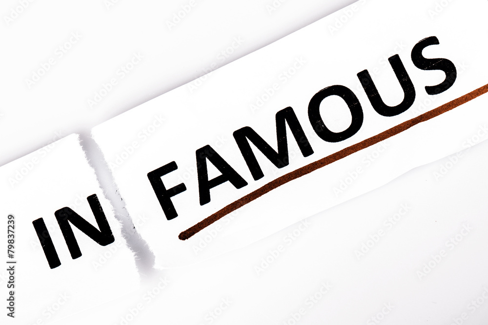 The word infamous changed to famous on torn paper Stock Photo | Adobe Stock