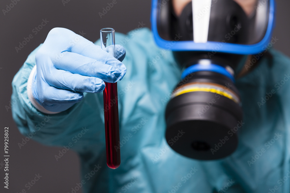 Scientist holding a sample of blood on grey background Stock Photo ...