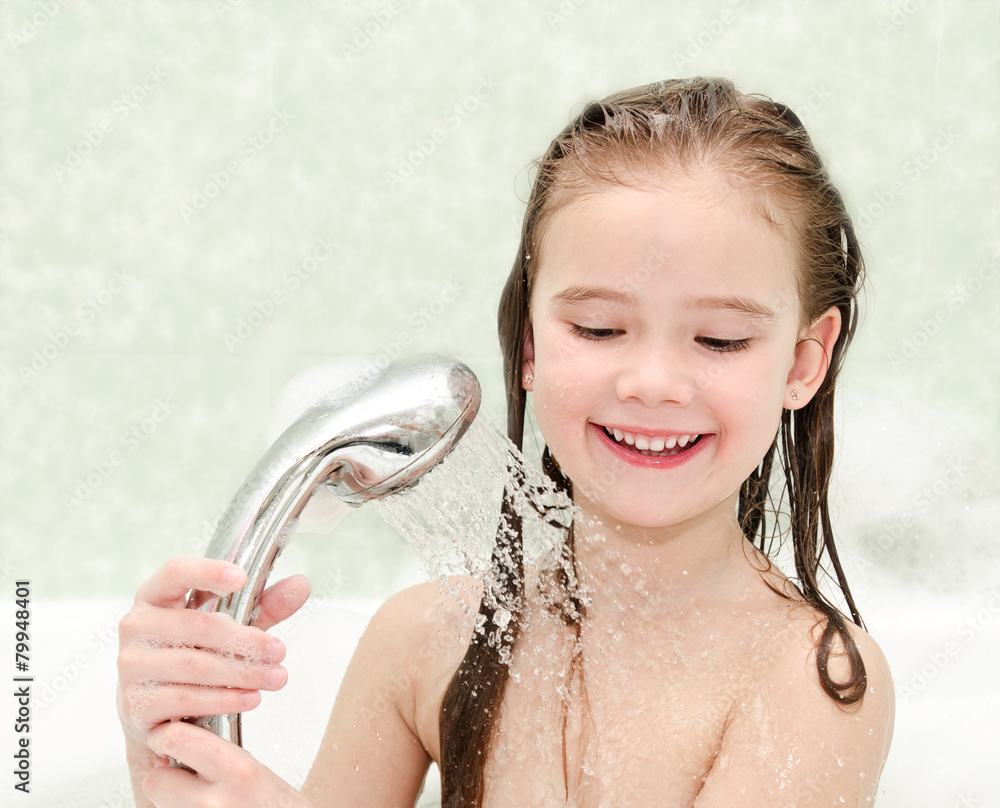 Happy little girl closeup taking shower Stock Photo | Adobe Stock
