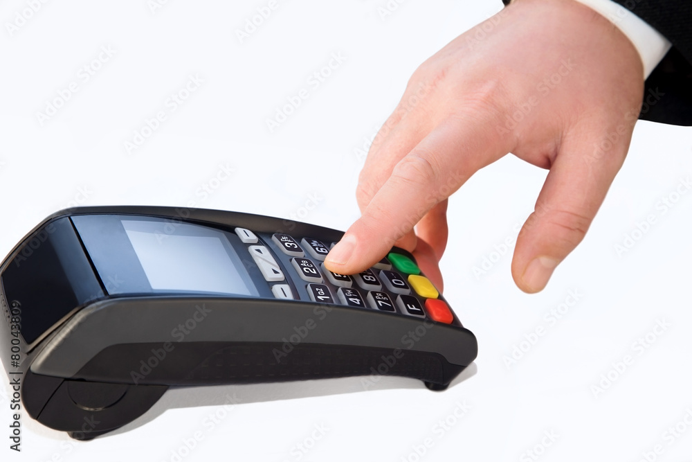 Hand and POS-terminal closeup Stock Photo | Adobe Stock