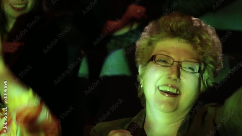 Theater audience breaks out into spontaneous dance routine. Jib-mounted ...