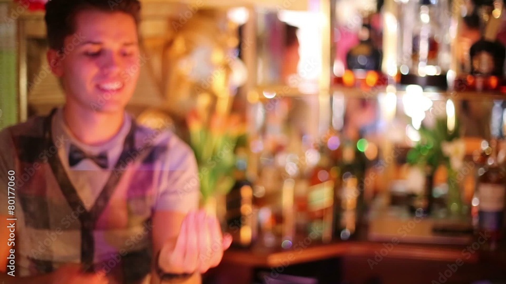 Young bartender ignites mixture on palm and blows it in bar Stock Video ...