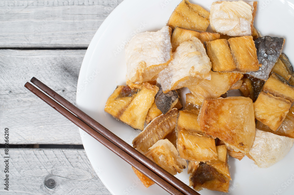 Vietnamese deep fried dried Pangasius kunyit fish, ca dua kho c Stock ...