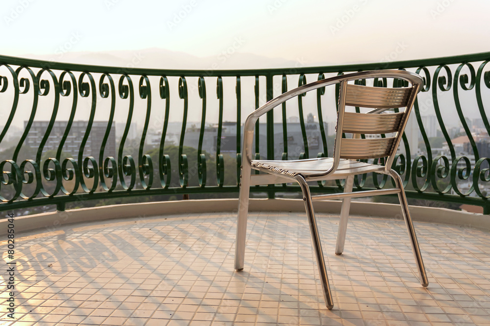 Aluminium chair on balcony Stock Photo | Adobe Stock