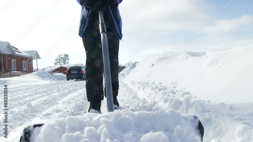 Man shoveling snow from the road Stock Video | Adobe Stock