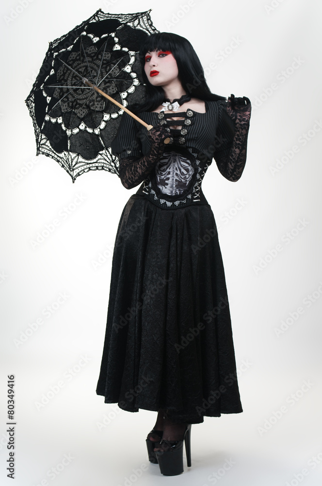 Gothic vampire girl in black dress with umbrella Stock Photo | Adobe Stock