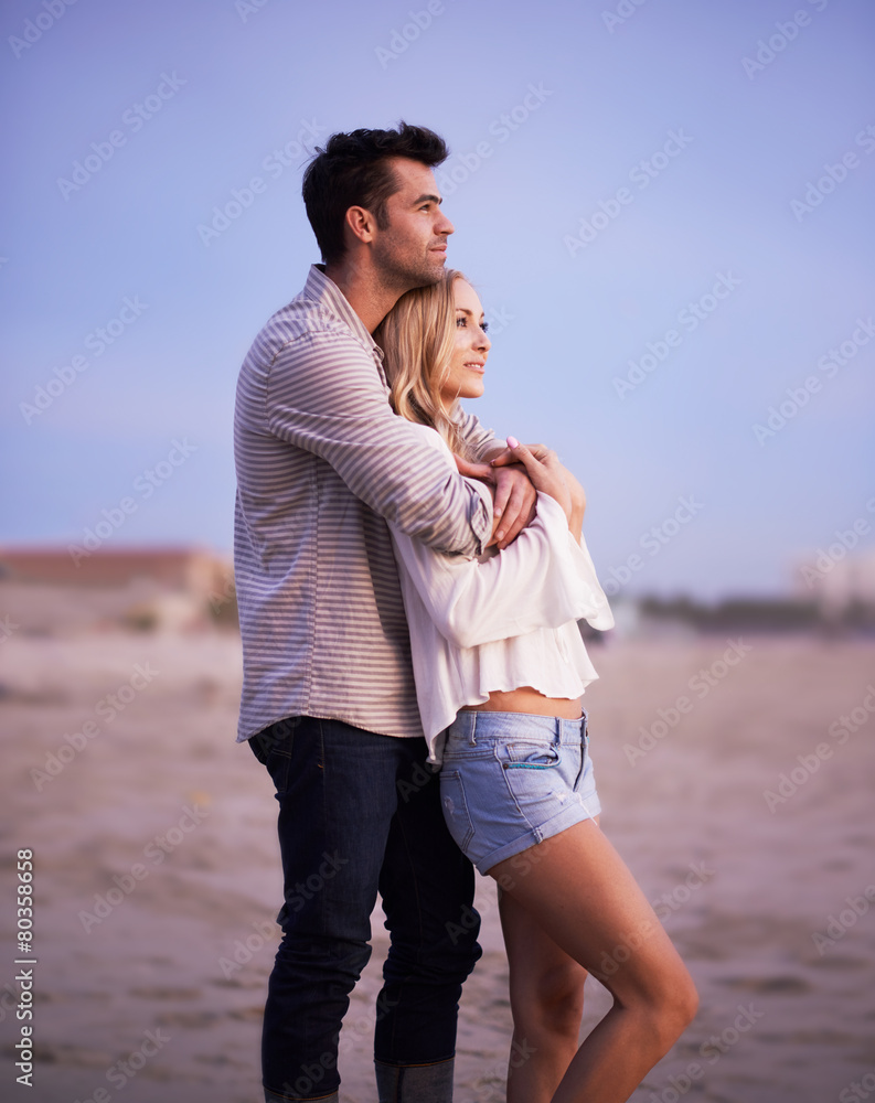 two romantic lovers on the beach at twilight Stock Photo | Adobe Stock