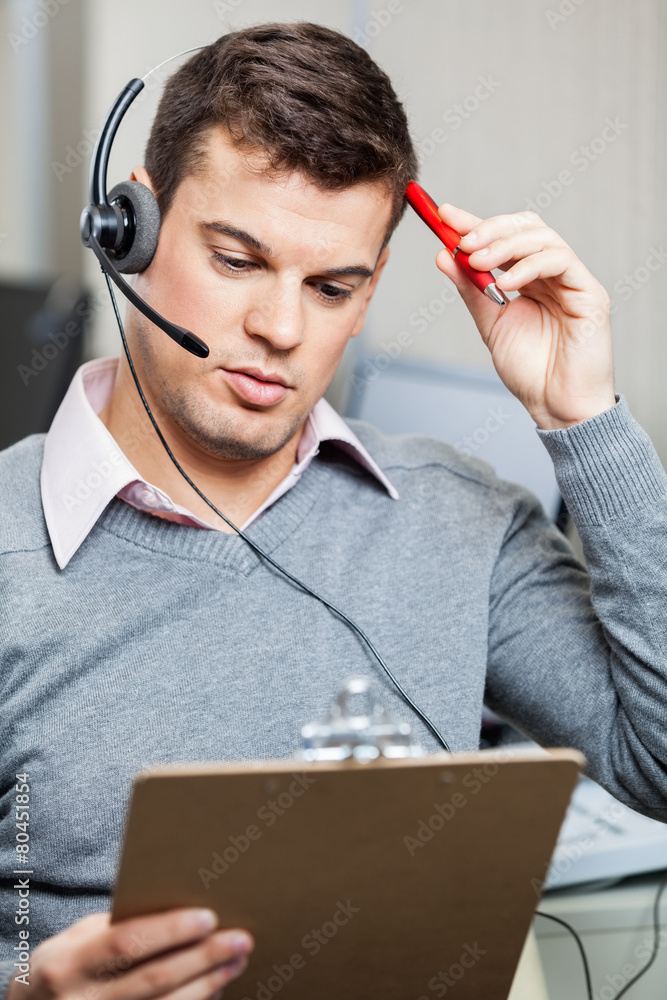Confused Customer Service Representative Holding Clipboard Stock Photo ...