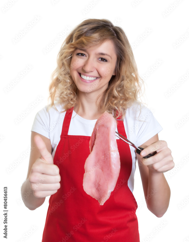 Sympathische Wurstverkäuferin mit frischem Steak Stock-Foto | Adobe Stock