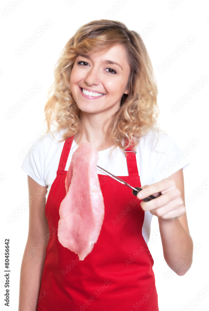 Lachende Wurstverkäuferin mit frischem Steak foto de Stock | Adobe Stock