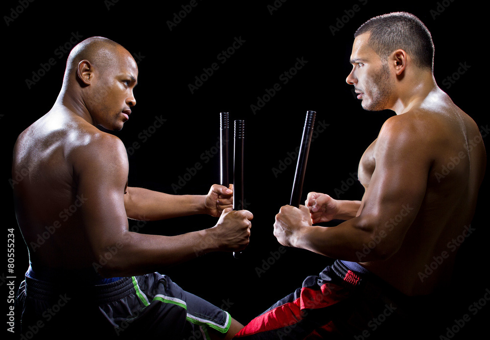 two men sparring with Filipino stick fighting martial arts Stock Photo ...