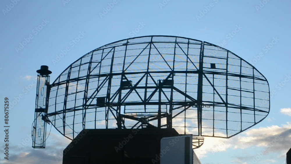 military radar station bearing on blue sky with clouds, modern ...