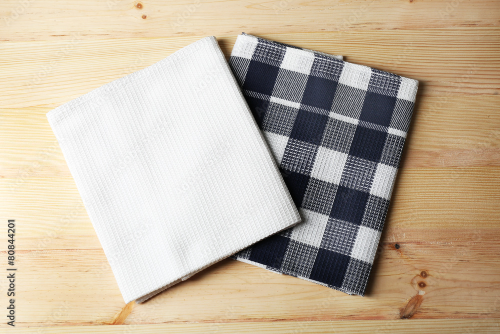 Kitchen towels on wooden background Stock Photo | Adobe Stock