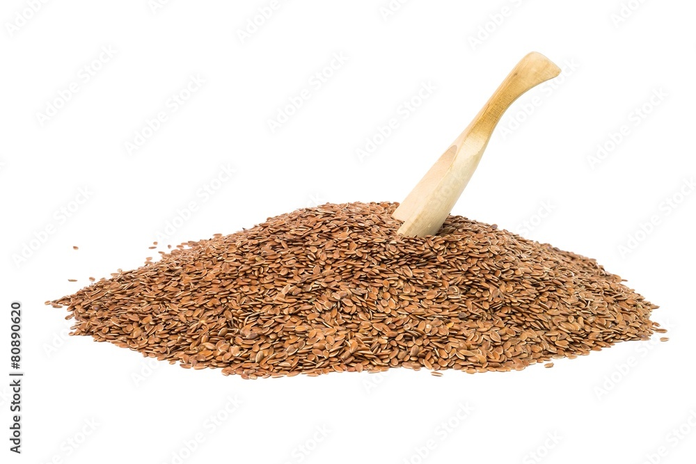 Pile of linseed with a wood spoon on white background Stock Photo ...