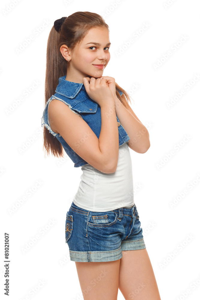 Stylish girl in a jeans vest and shorts. Street style teenager Stock ...