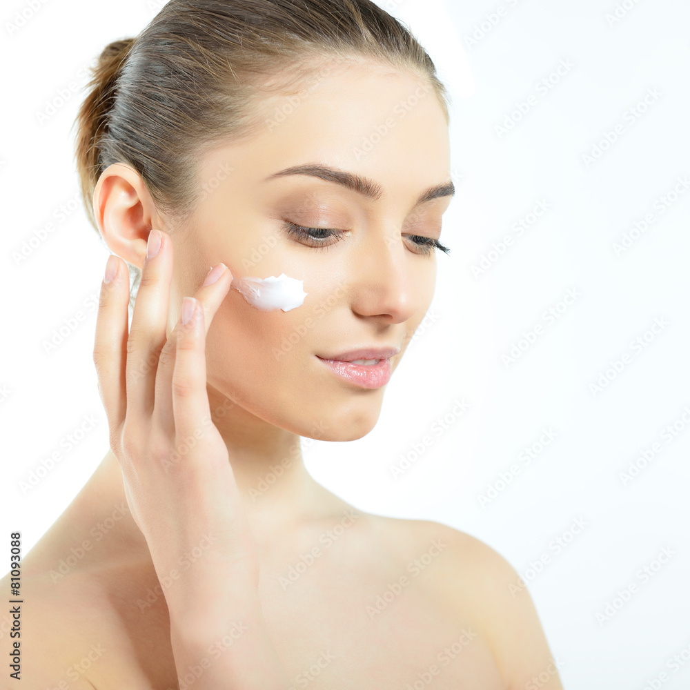 Beautiful young woman applying cream on her face. Girl with perf Stock ...