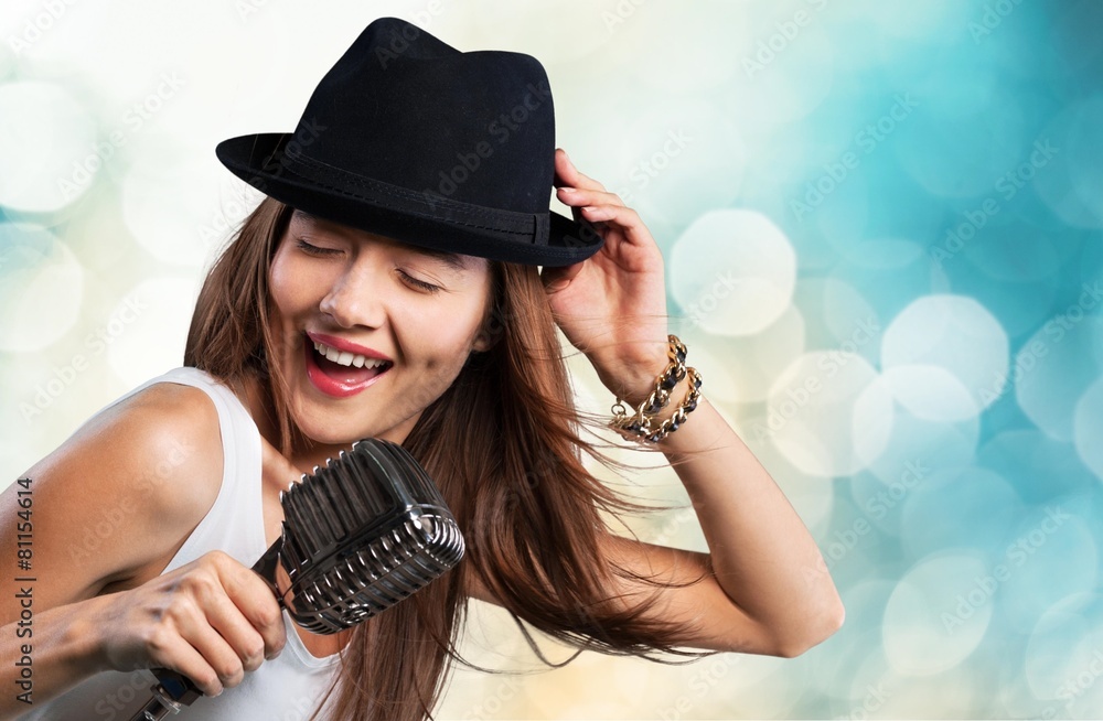 Singer. Female performer at disco with mic Stock Photo | Adobe Stock