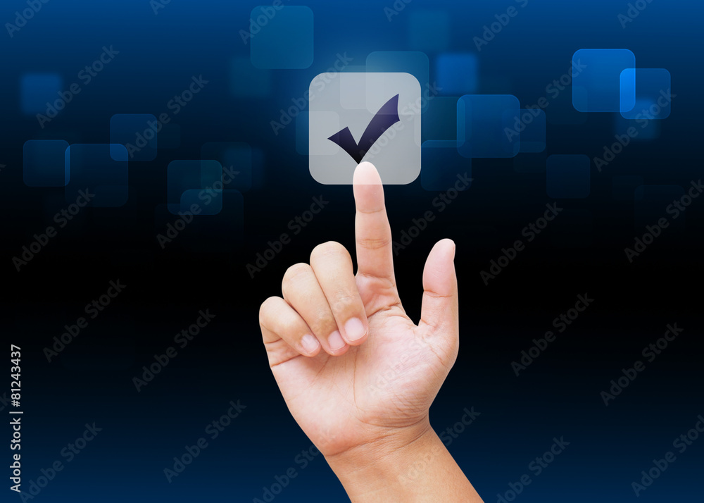 Hand pressing check mark buttons with technology background Stock Photo ...