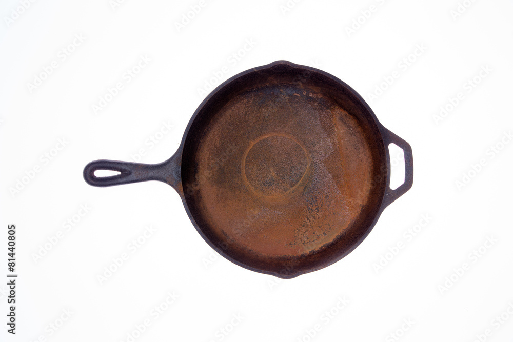 Old rusty round cast iron frying pan Stock Photo | Adobe Stock