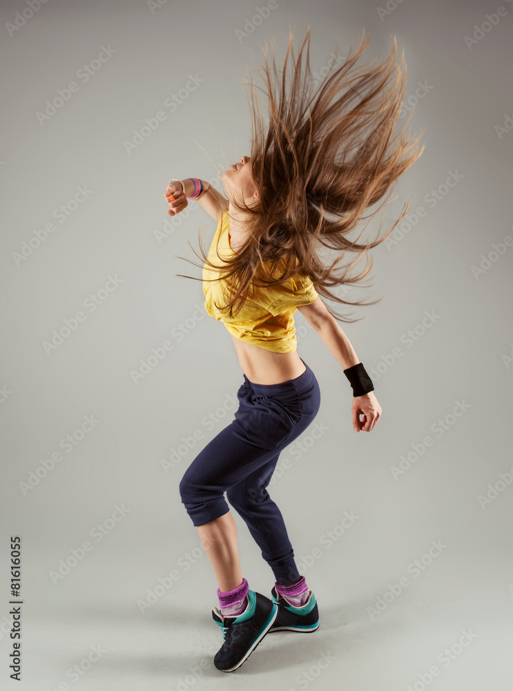 Portrait of young modern girl dancing hip hop in dance studio. Stock ...