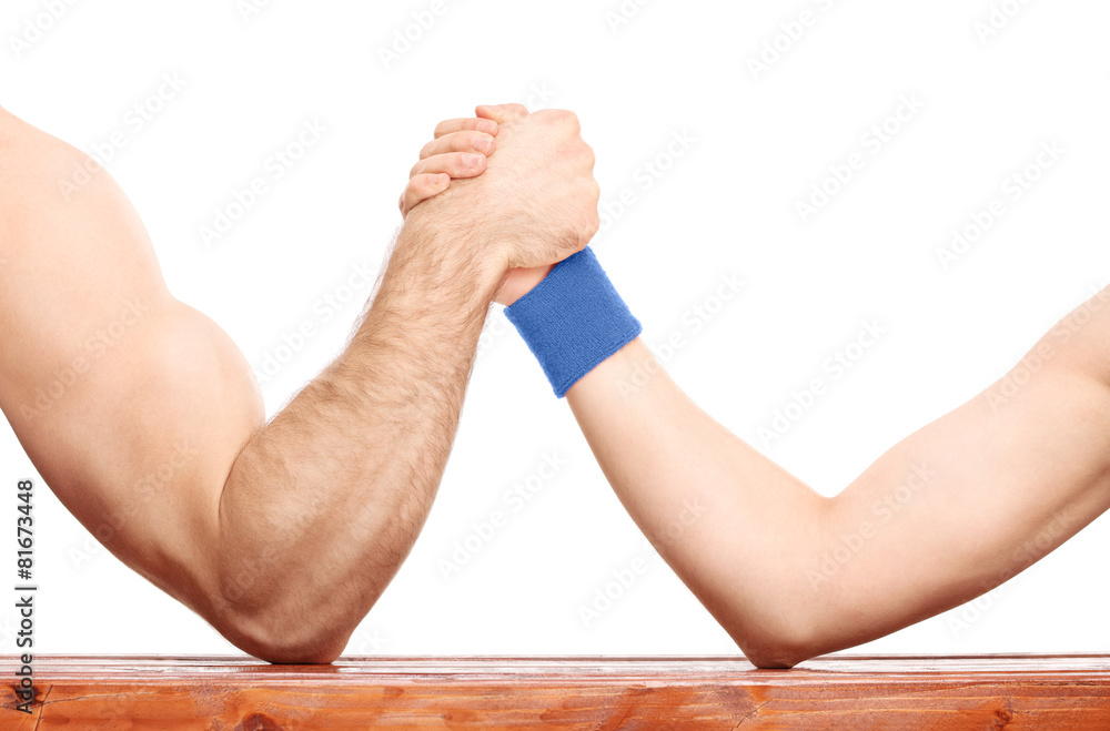 Arm wrestling between a muscular arm and skinny one Stock Photo | Adobe ...