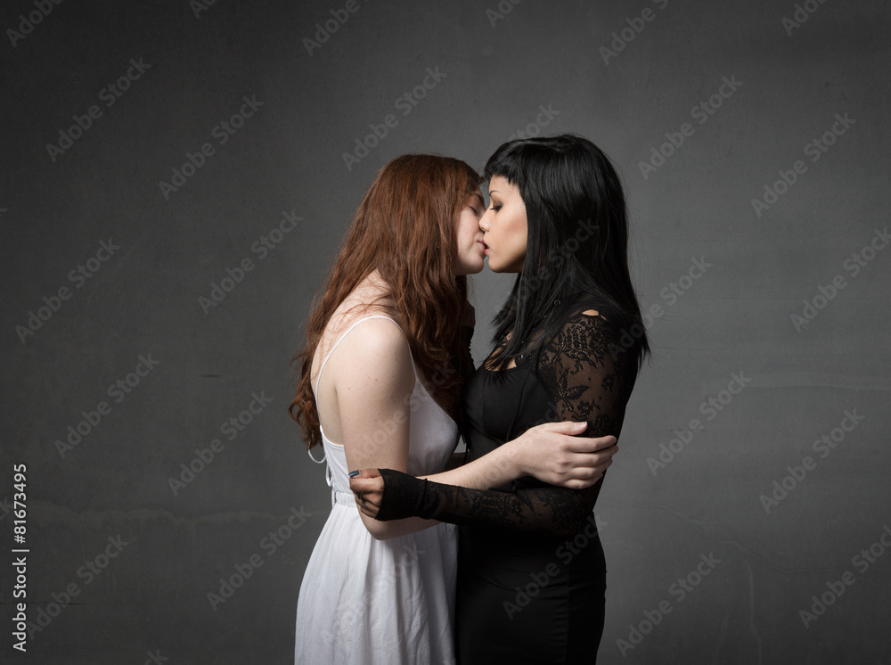 lesbians kisses in dark background Stock Photo | Adobe Stock