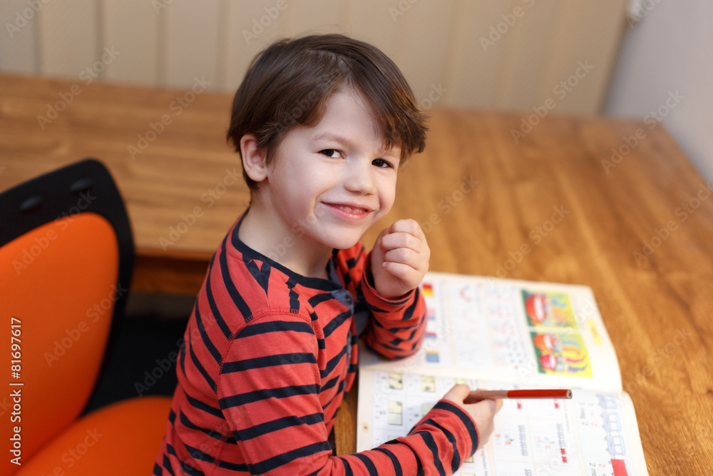 Preschooler genius boy solving math exercise Stock Photo | Adobe Stock