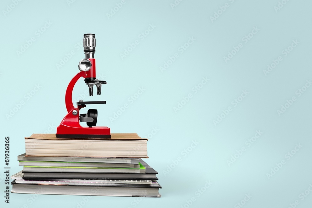 School. Color photo of a microscope on stack of books Stock Photo ...
