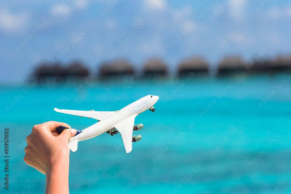 Small white toy airplane on tropical beach background water Stock Photo ...